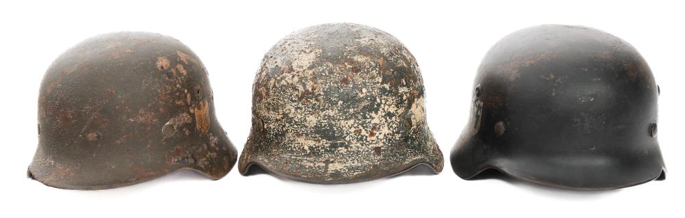 At Auction: WWII GERMAN DUG RELIC M40 COMBAT HELMETS