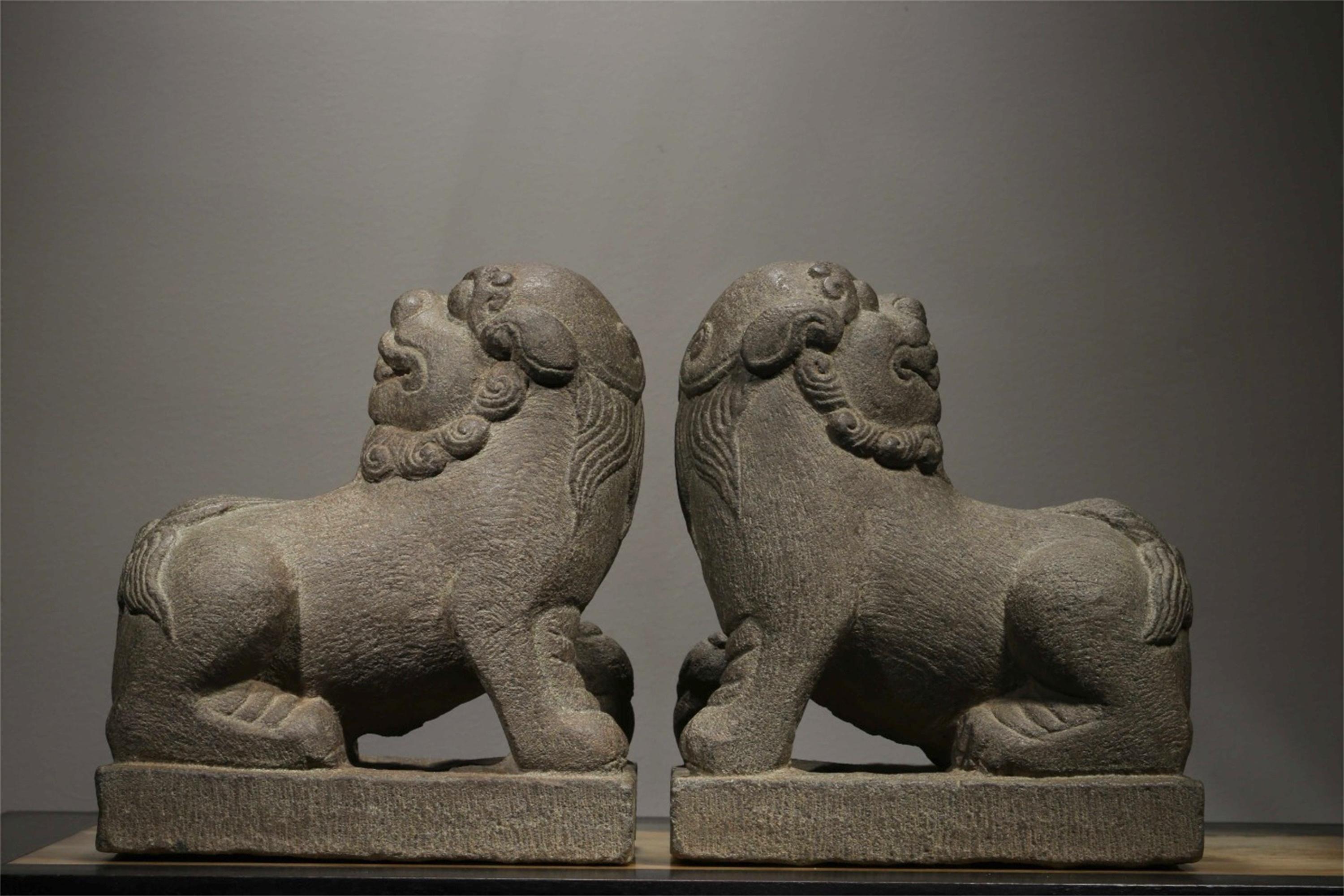 At Auction: A Pair of Chinese Carved Stone Foo-Dogs