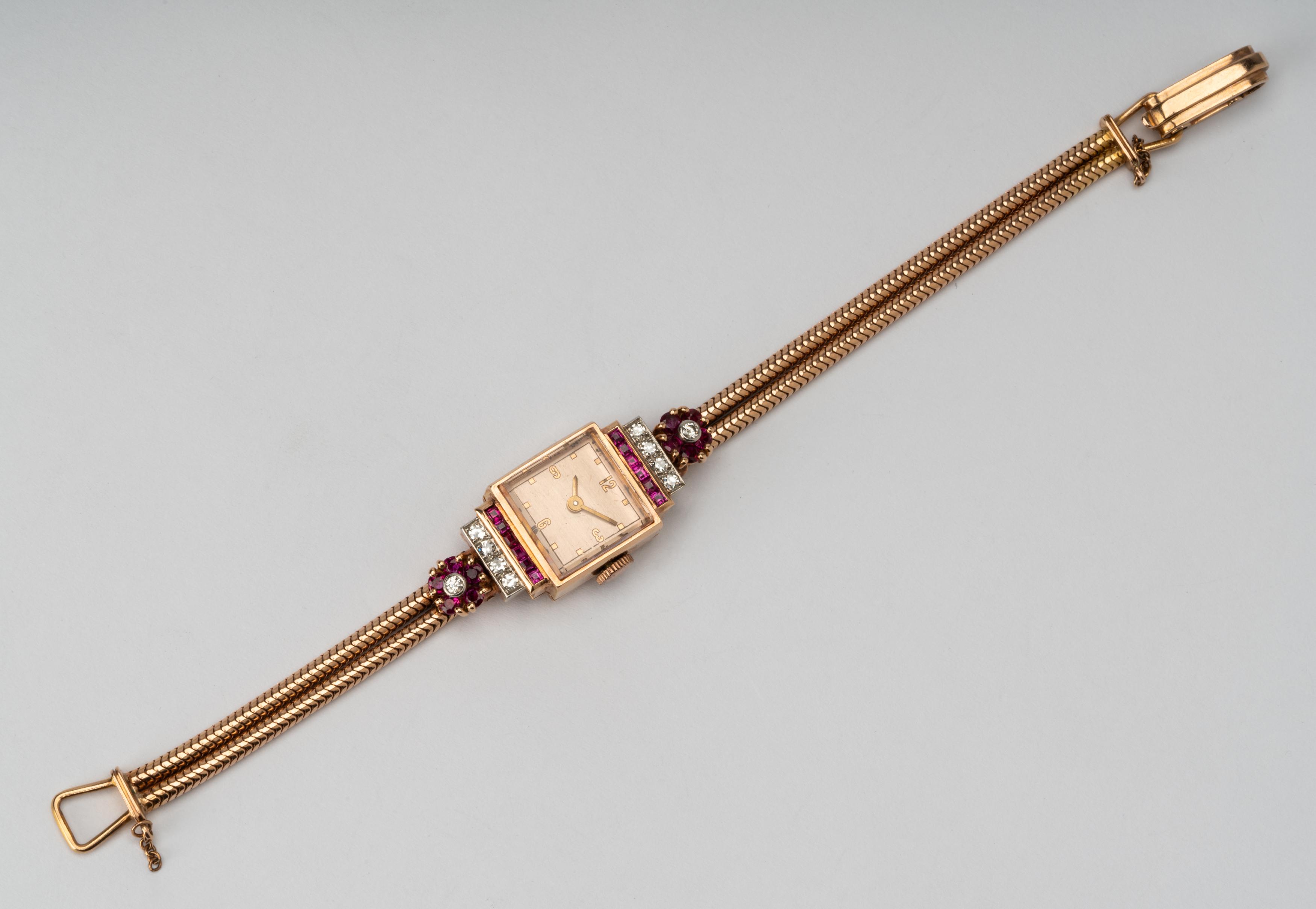 Lot - 14 KARAT ROSE GOLD DIAMOND & RUBY WATCH