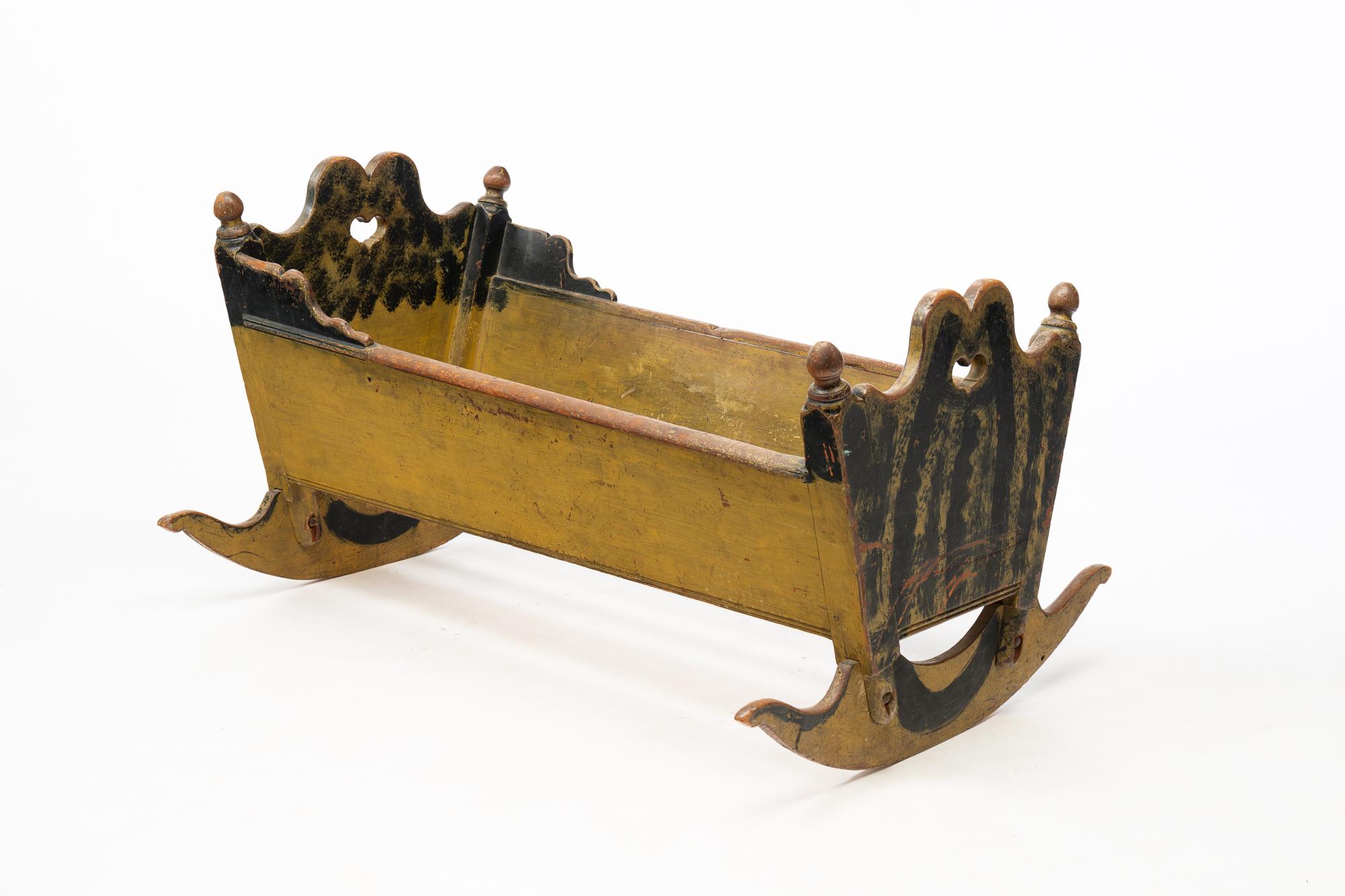 Lot - EARLY FOLKSY PAINTED AND DECORATED CRADLE.