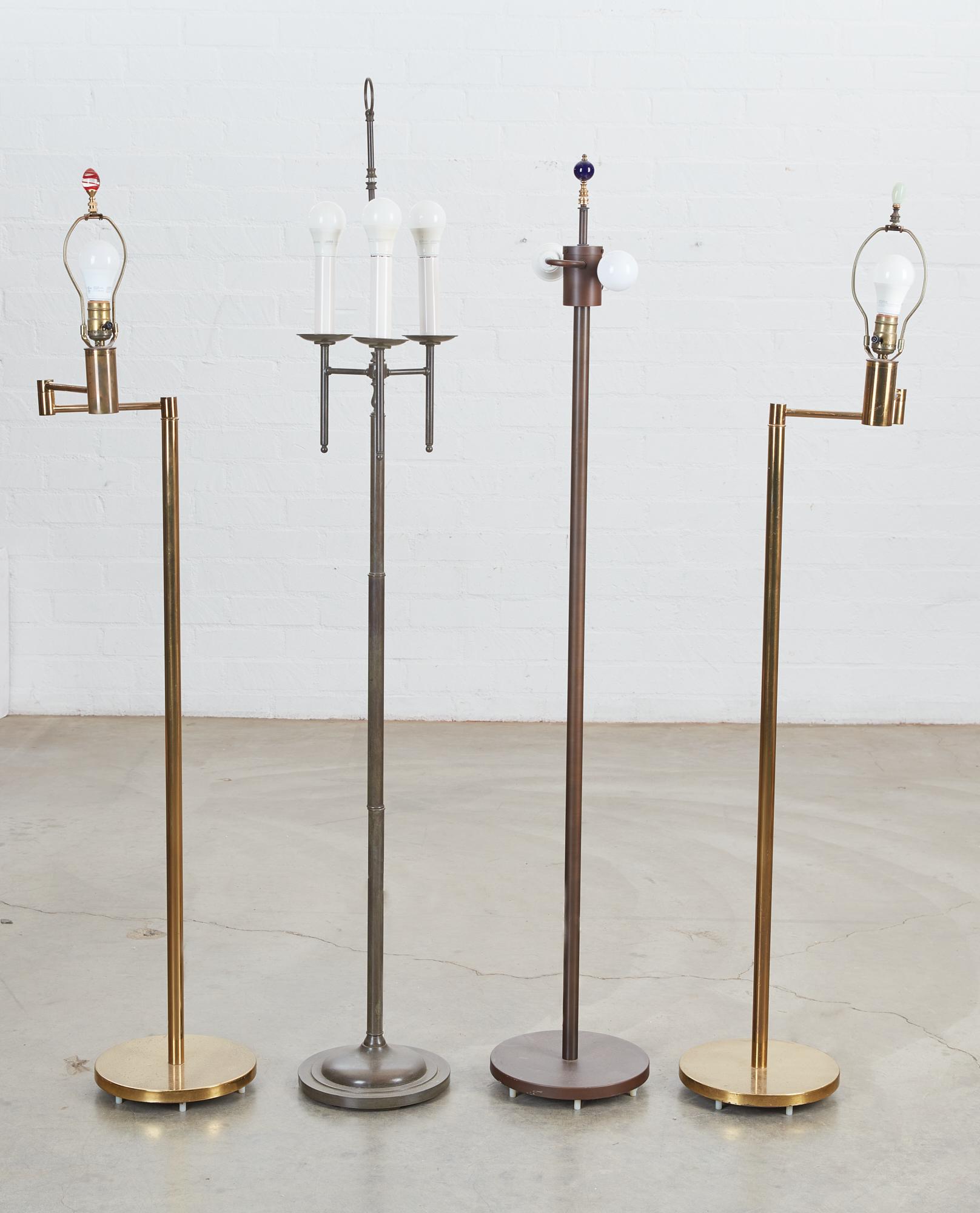 Lot - A group of four mixed metal floor lamps, post 1950