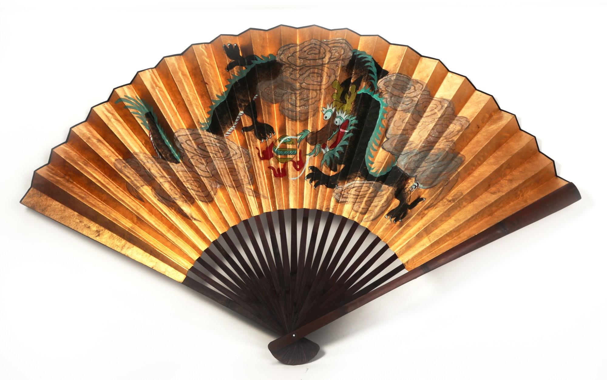 Lot - A large Asian decorative fan