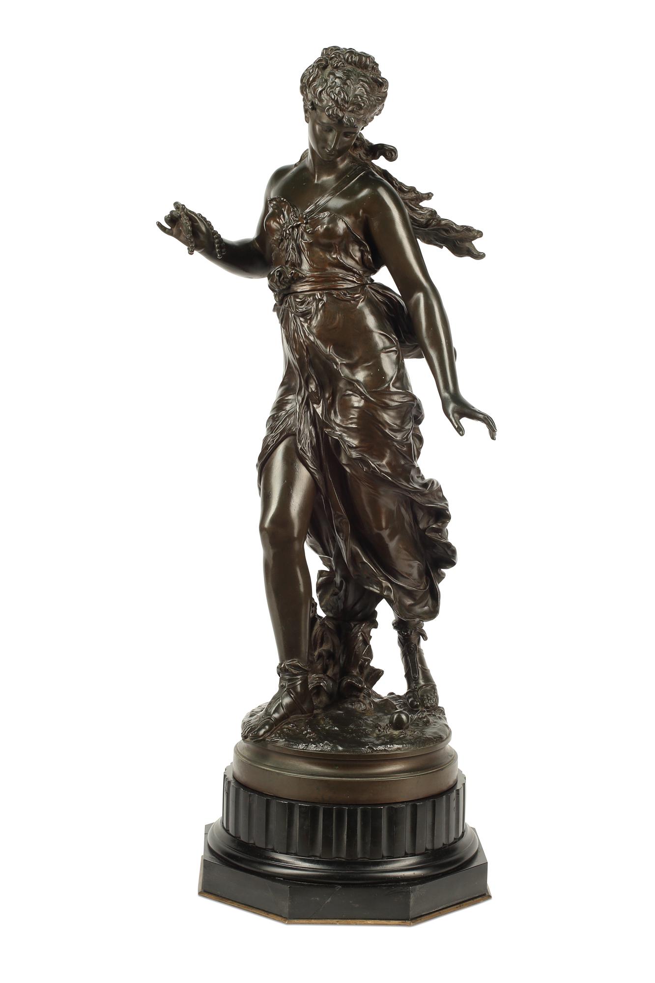 Lot - A French patinated bronze figure of a classical maiden, after a ...