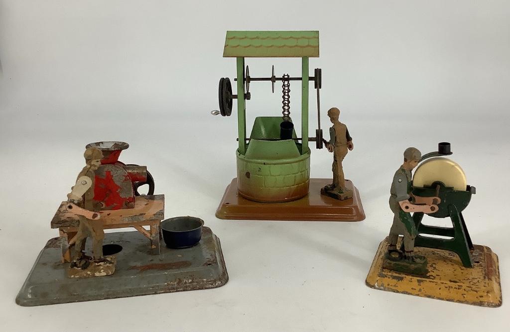 Lot - Three early tin pulley toys- including well and grinding wheel