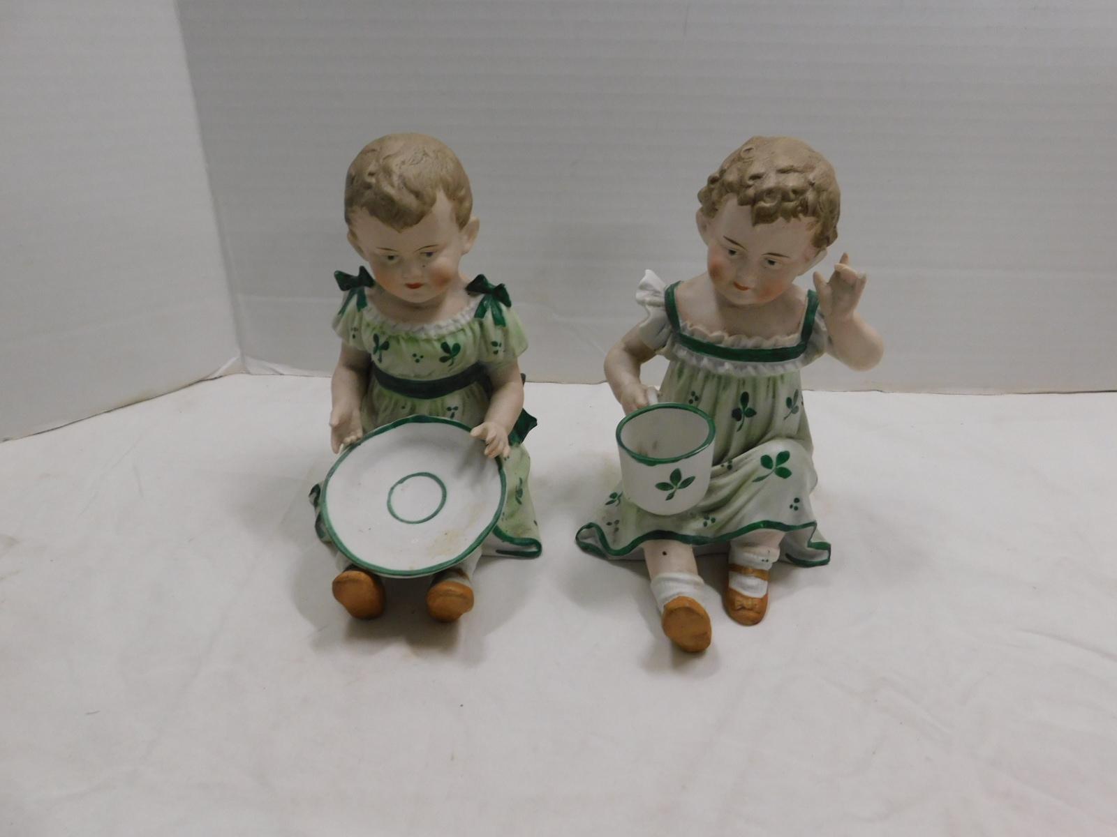 Lot - 2 Bisque Piano Babies