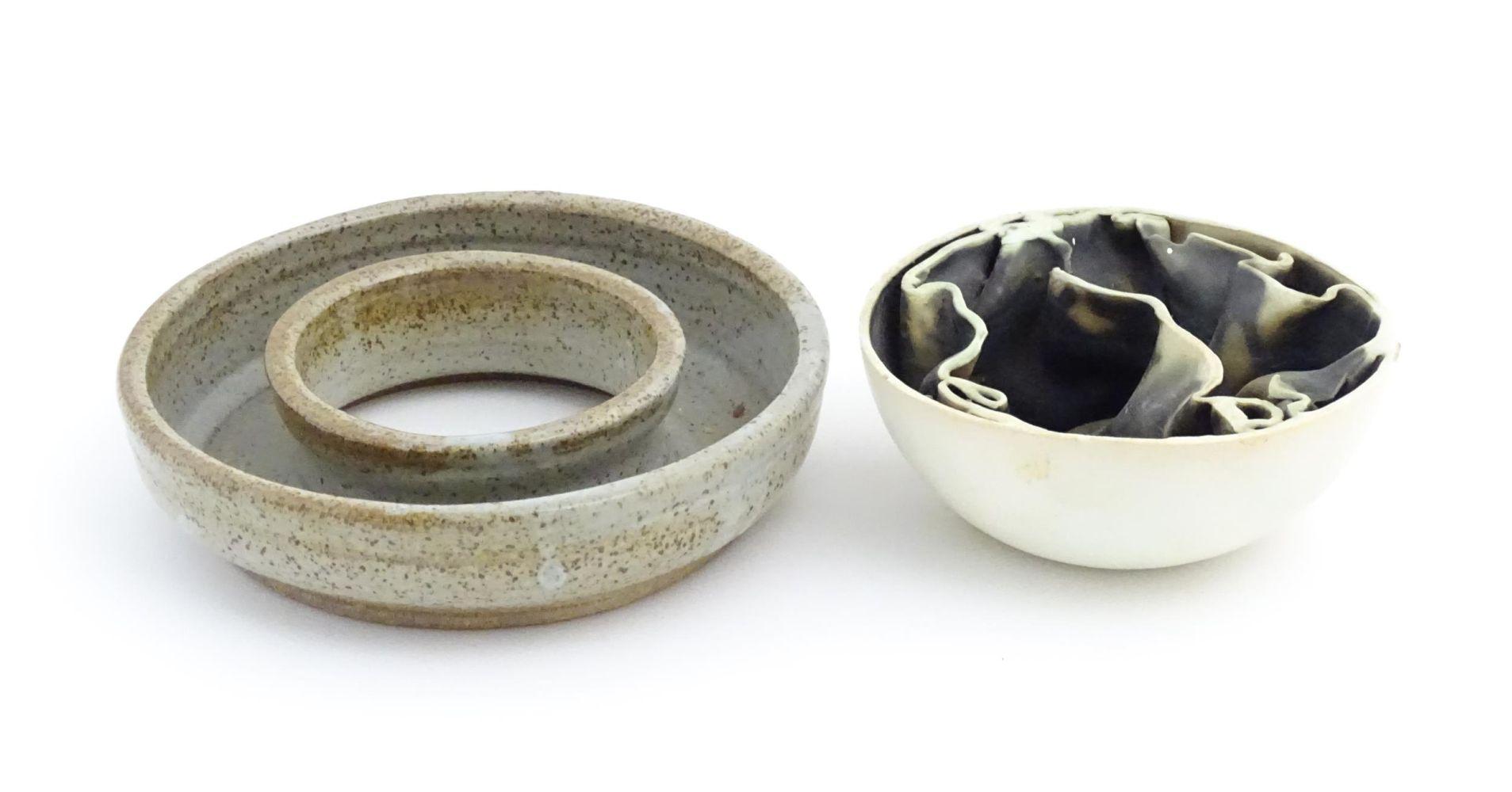 At Auction: A studio pottery stoneware dish of doughnut form,