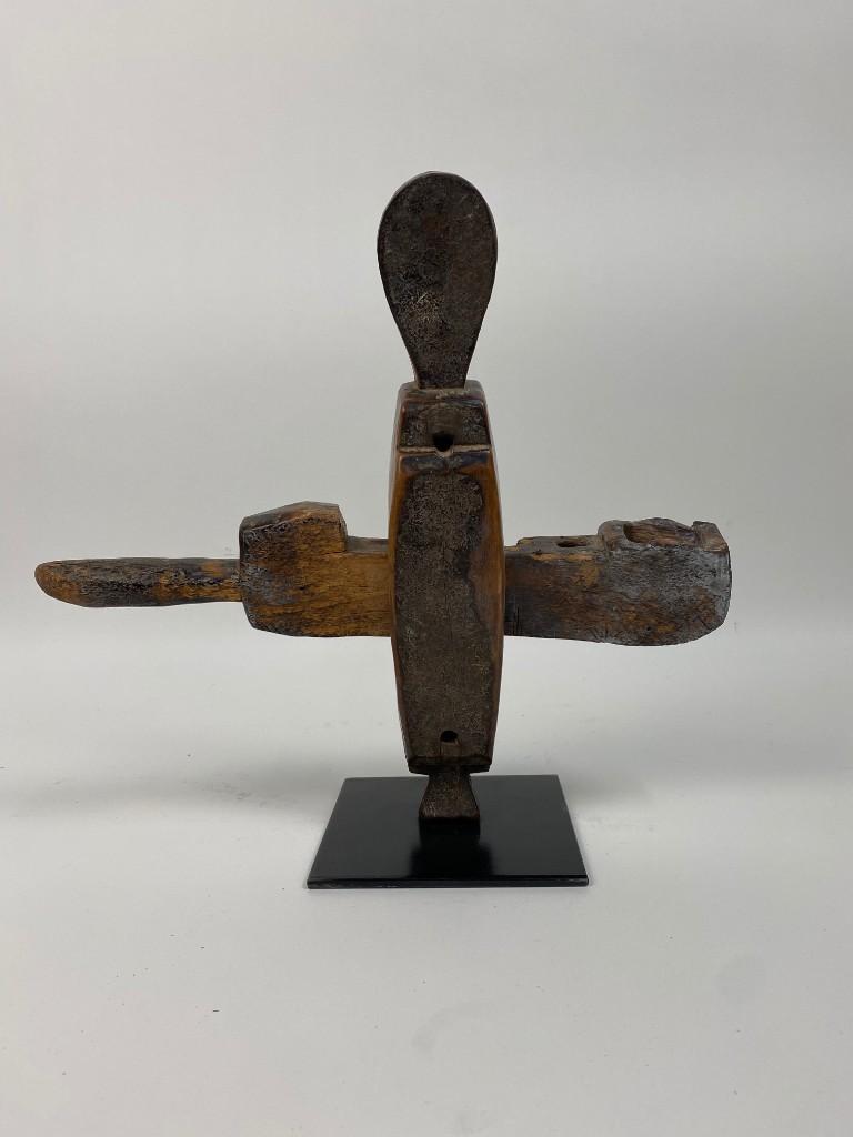 Lot - A carved wooden African door lock