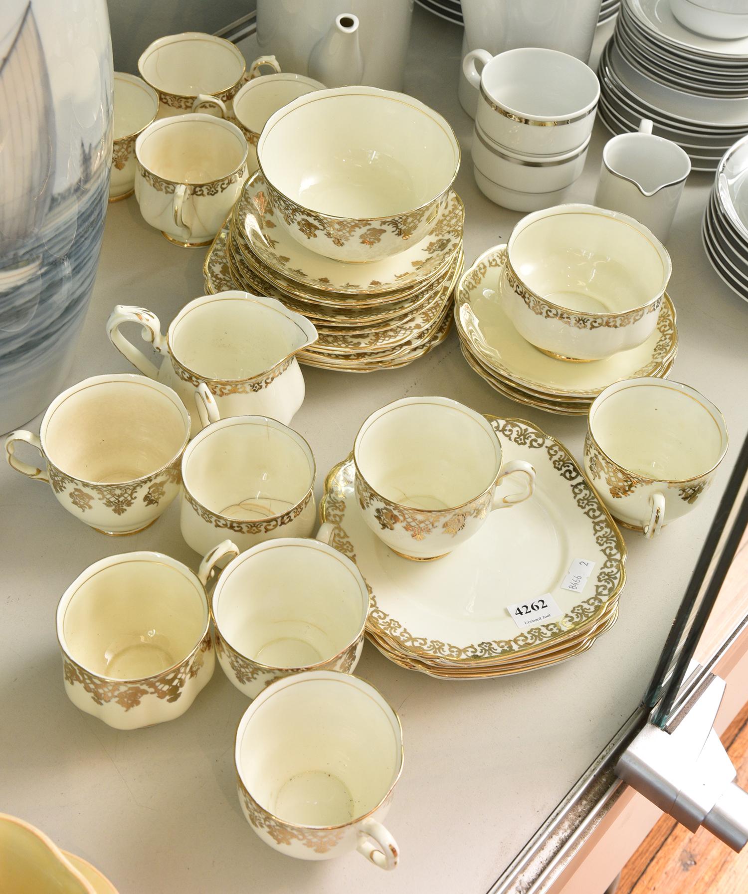 Lot - A ROYAL ALBERT TEA SET IN TWO PATTERNS WITH GILT DETAIL (HAIRLINES)