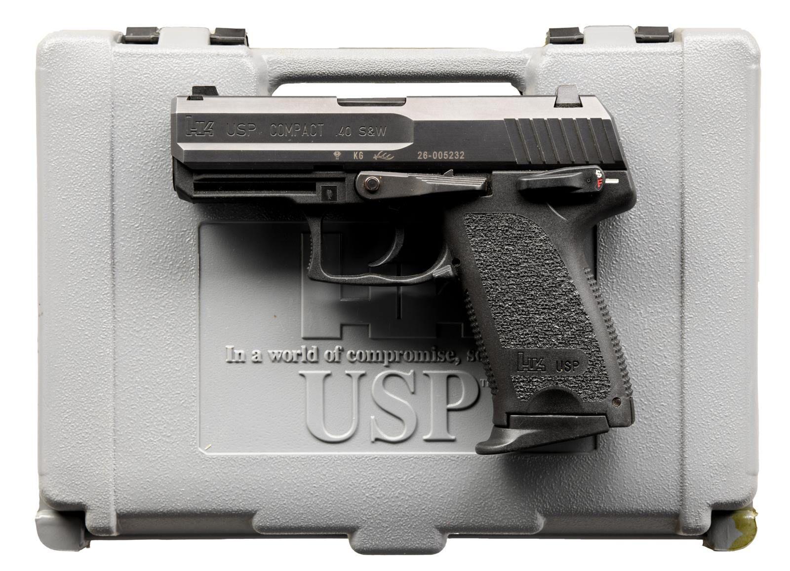 At Auction: HK USP COMPACT SEMI AUTO PISTOL.