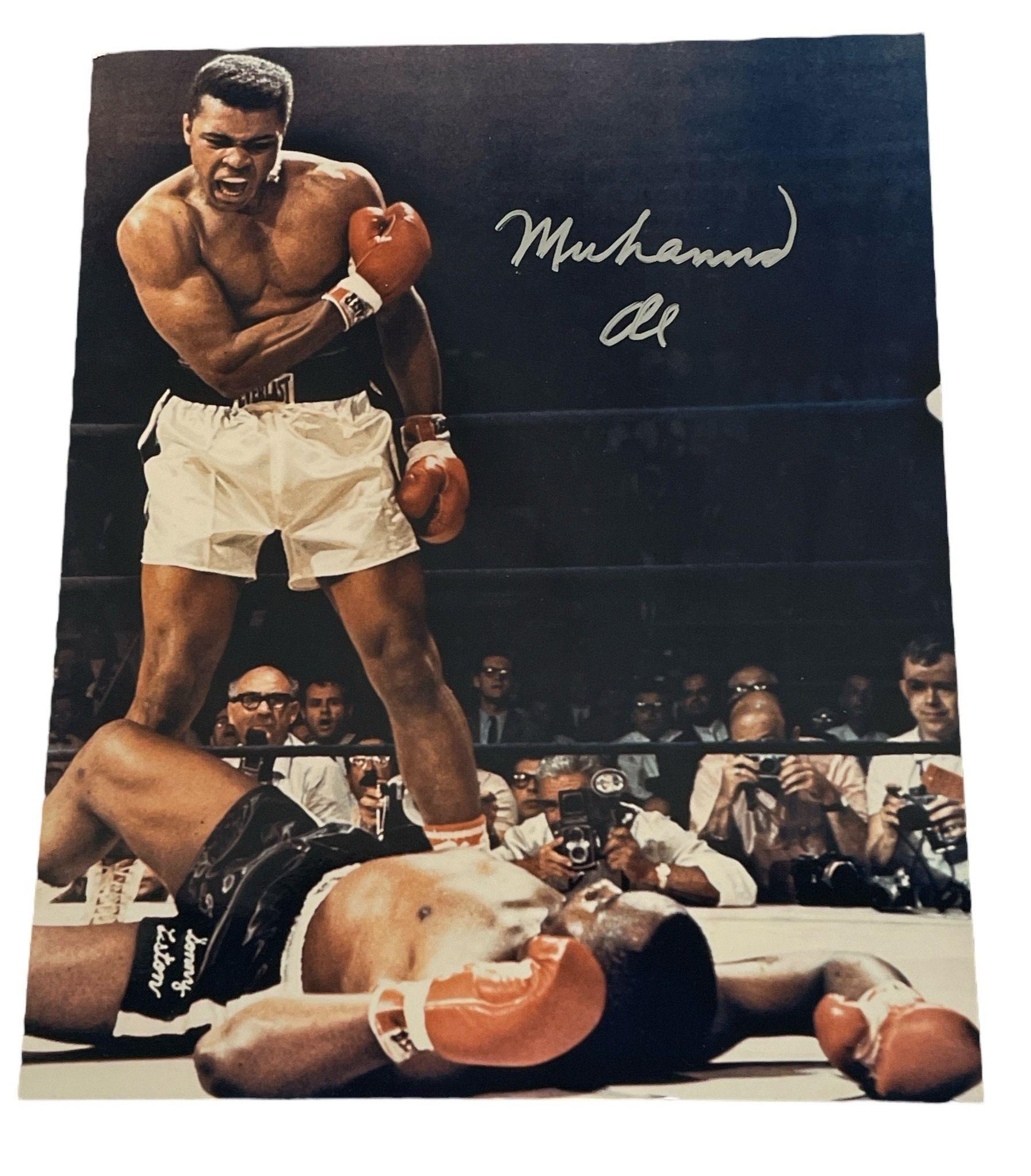 At Auction: MUHAMMAD ALI Defeating Sonny Liston Signed Photograph