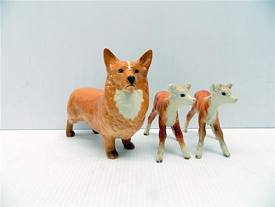 Lot - Beswick Corgi together with two Beswick calves (3)