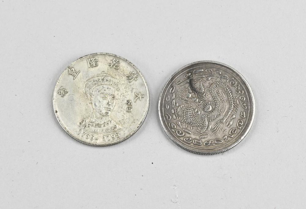 Sold at Auction: 2x Chinese coin Ø 3.8 cm.